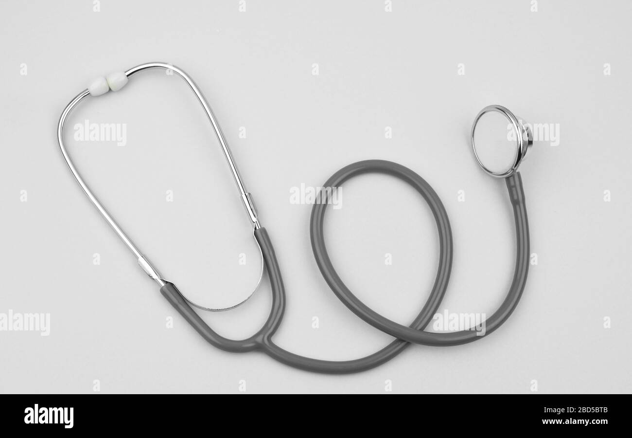 A single normal stethoscope isolated on top of a white color empty ...