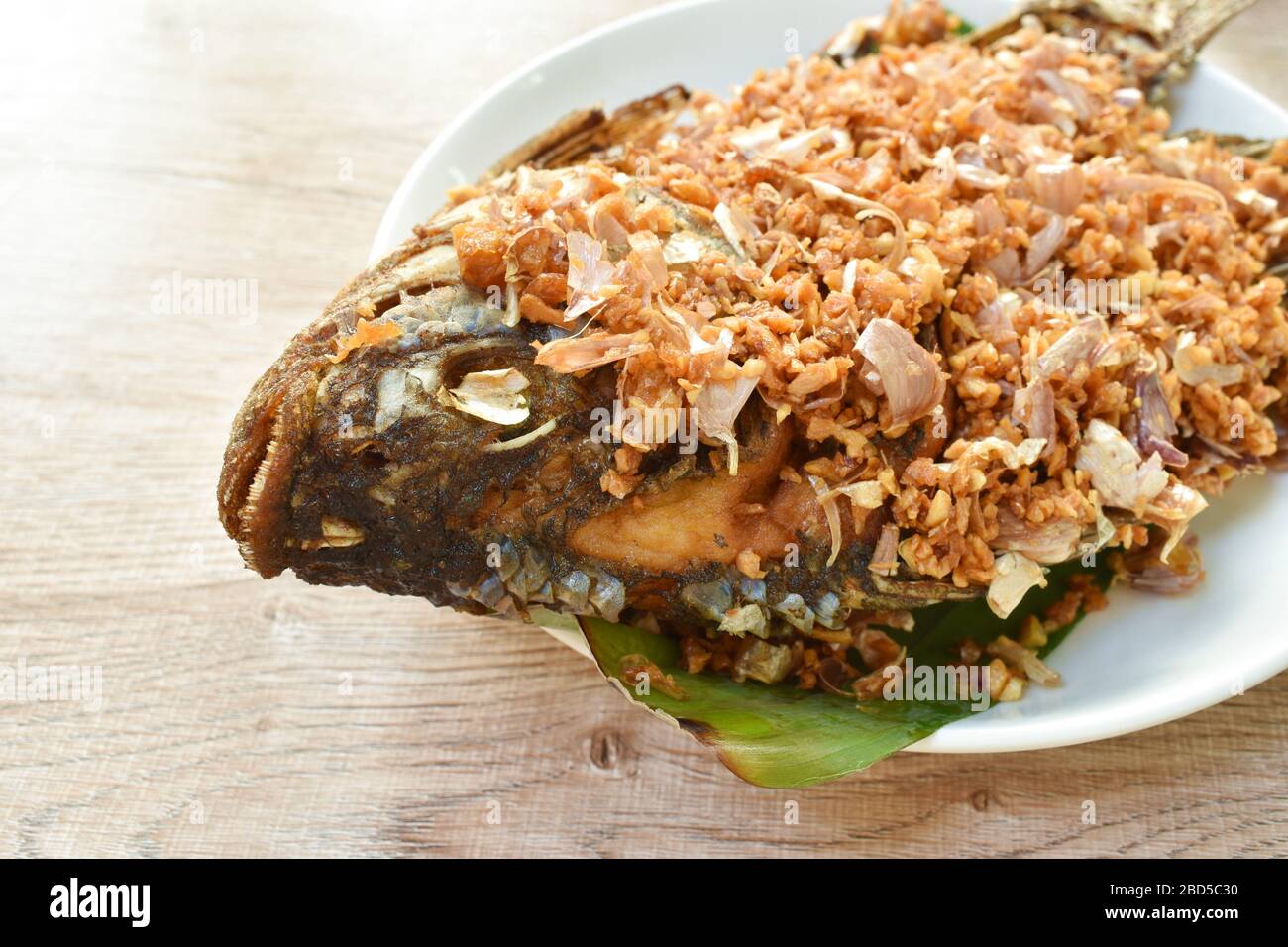 batter fried mango fish topping chop garlic dipping sweet and soy sauce ...