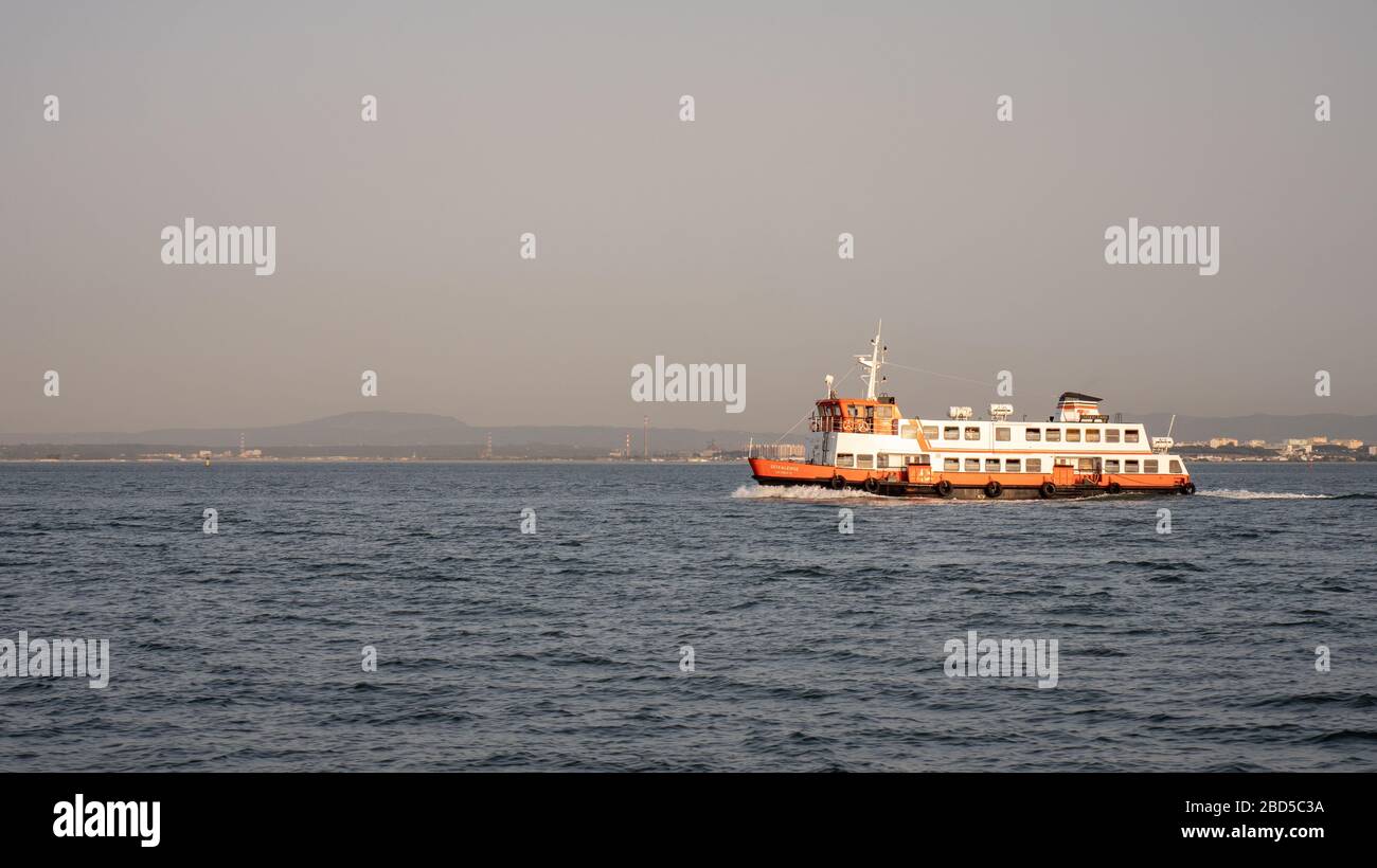 Lisbon Passenger Ferry, Portugal. The orange and white colours of the ...