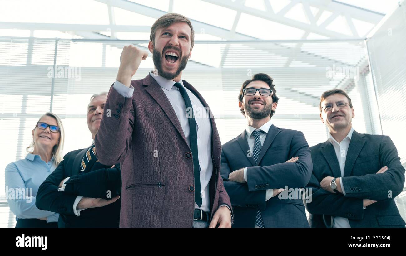 Very happy young businessman showing his success Stock Photo - Alamy