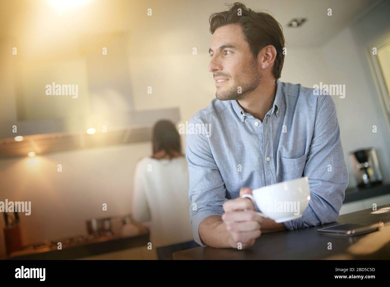 young man in house containment Stock Photo - Alamy