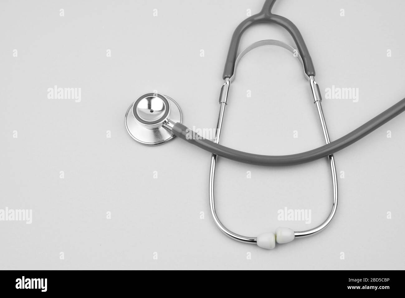 Single stethoscope isolated on a white paper empty background with the ...