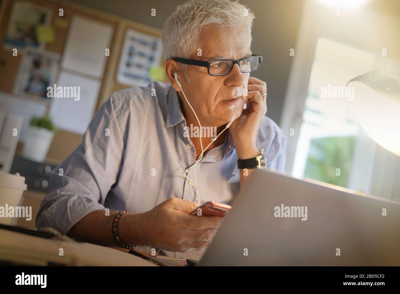 boss in home confinement working on his laptop Stock Photo - Alamy