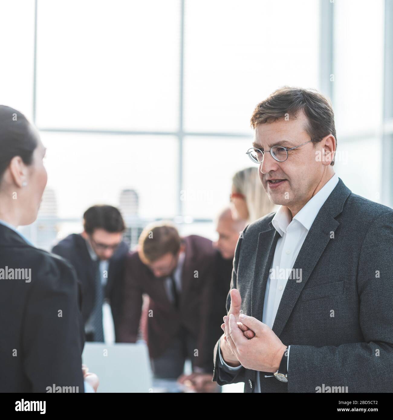 close up. working group discussing the crisis situation Stock Photo - Alamy