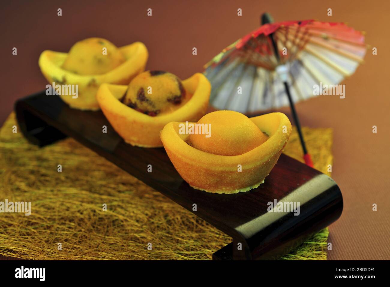 The food portrait of cake gold ingot shape Stock Photo - Alamy