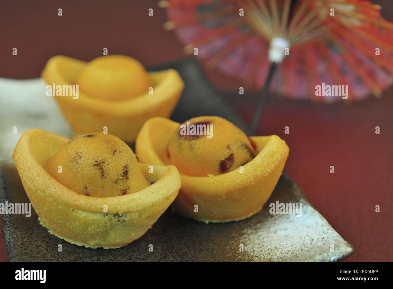 The food portrait of cake gold ingot shape Stock Photo - Alamy