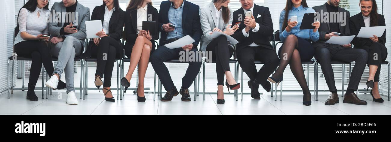 group of employees using their devices in the conference room Stock ...