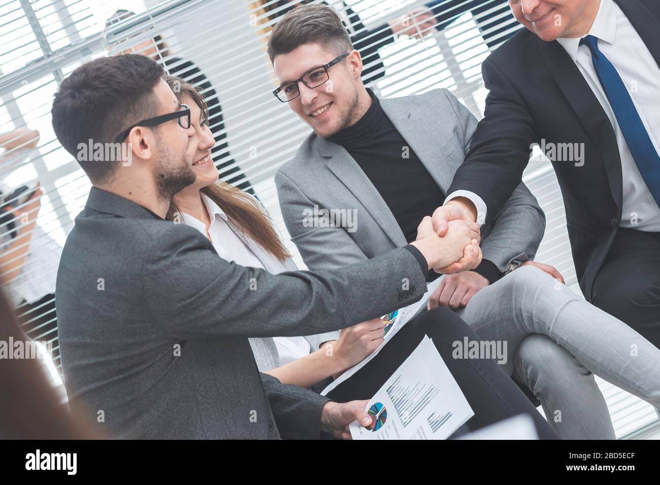 business partners shaking hands at a work meeting Stock Photo - Alamy