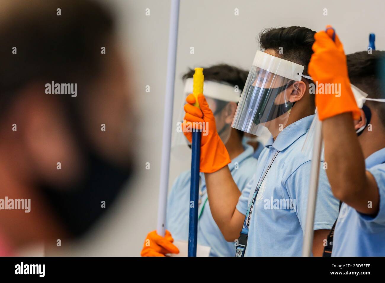 Manila, Philippines. 7th Apr, 2020. Janitors wearing face shields and ...