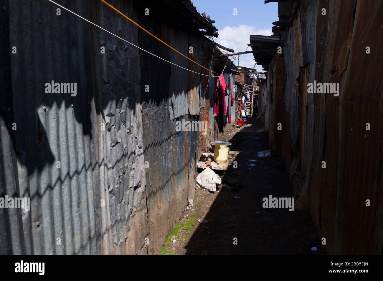Washing hanging in an alleyway, Mathare, Nairobi, Kenya. Mathare is a ...