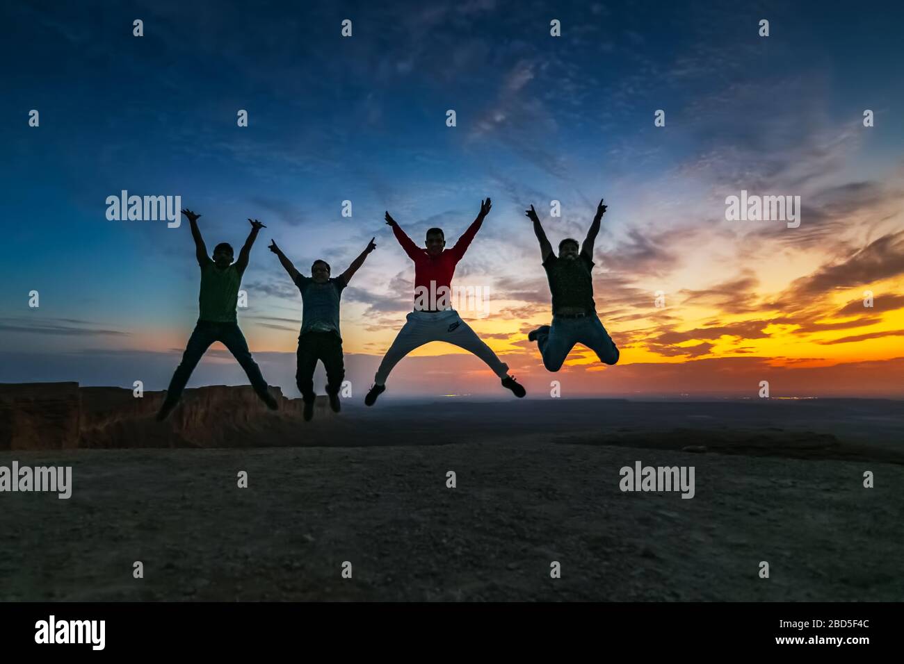 Happy friends sunset jump friendship hi-res stock photography and ...