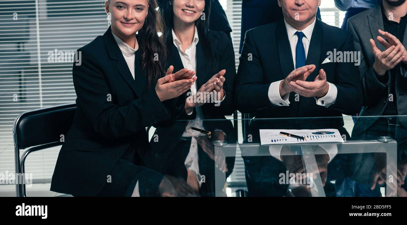 boss and the happy business team applauding their success Stock Photo ...