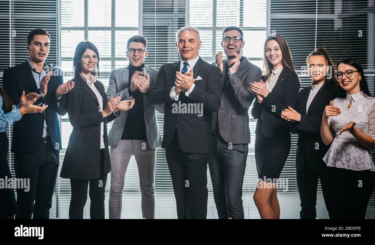 group of happy employees applauding their success Stock Photo - Alamy