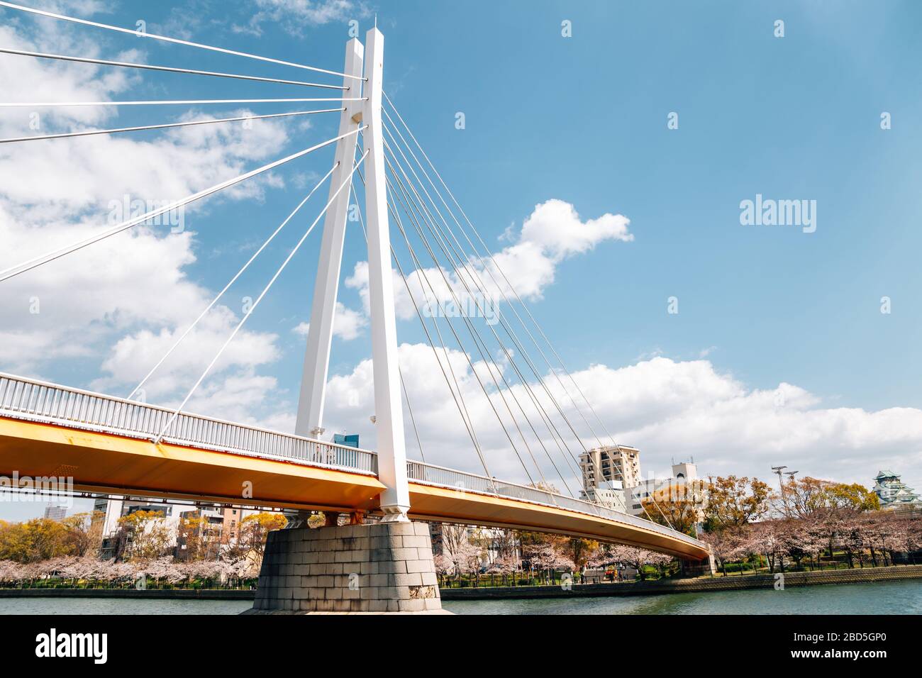 O river and Osaka Tenma Kawasaki Bridge at spring in Osaka, Japan Stock ...