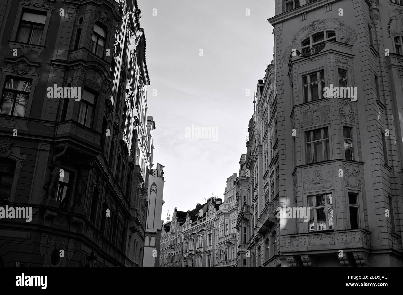 Sunset seen from a street in Prague through the buildings (Czech ...