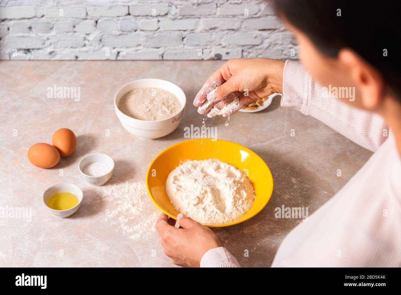homemade bread baking. closeup woman hands mixing ingredients for dough ...
