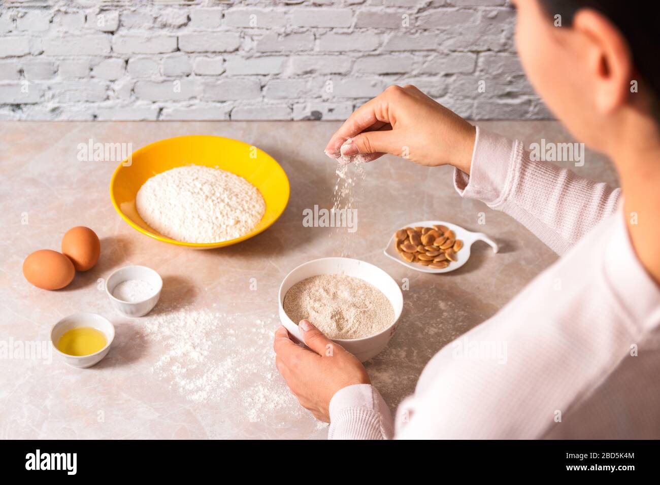 homemade bread baking. closeup woman hands mixing ingredients for dough ...