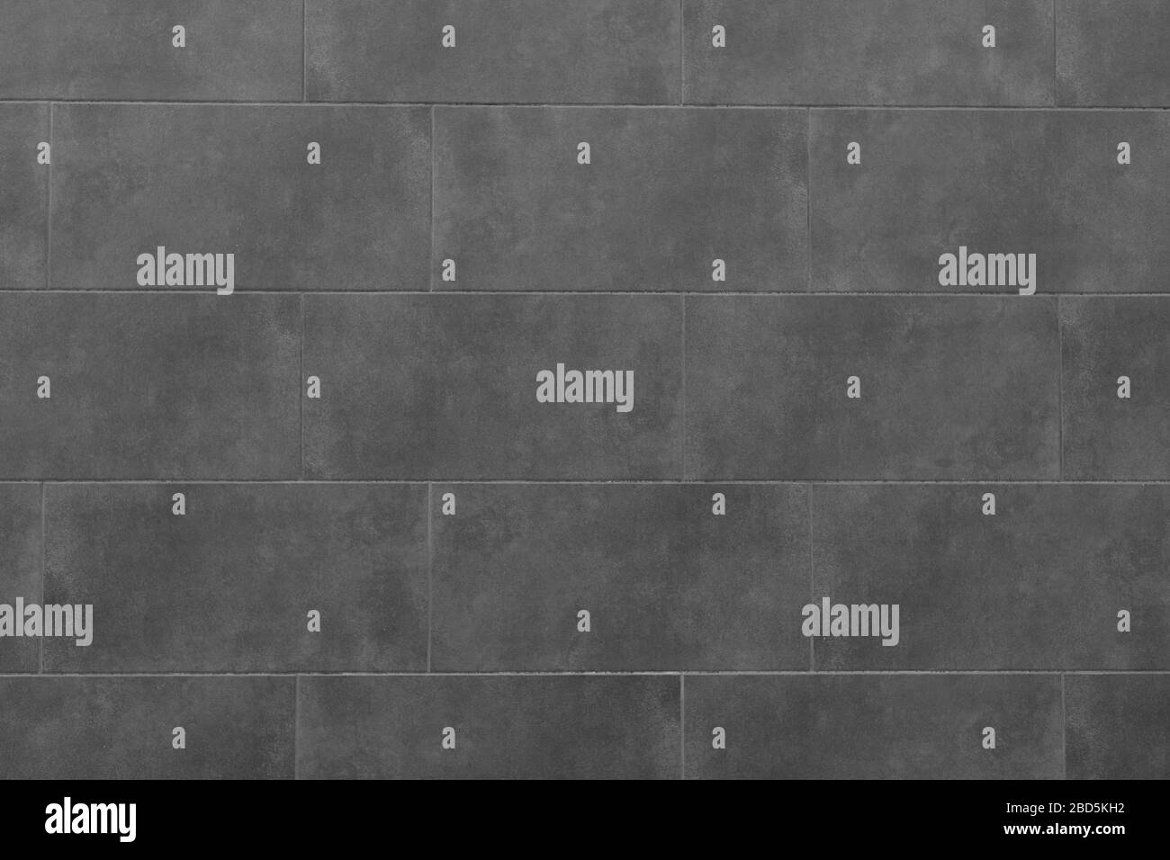 The texture of the black tile wall. Background of black tiled wall ...