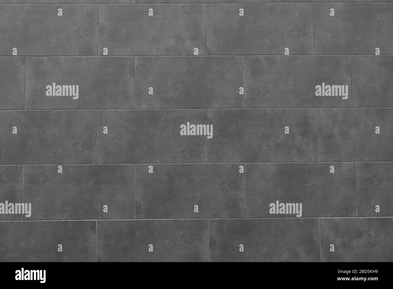 The texture of the black tile wall. Background of black tiled wall ...