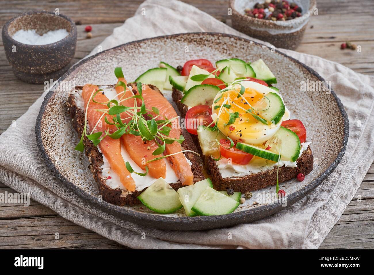 Smorrebrod - traditional Danish sandwiches. Black rye bread with salmon, cream cheese Stock ...