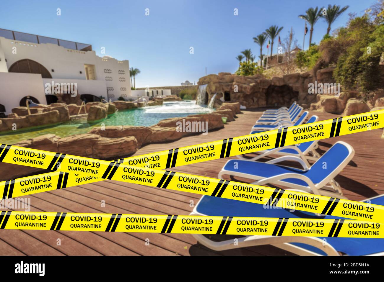 Biohazard Coronavirus warning tapes against swimming pool with ...