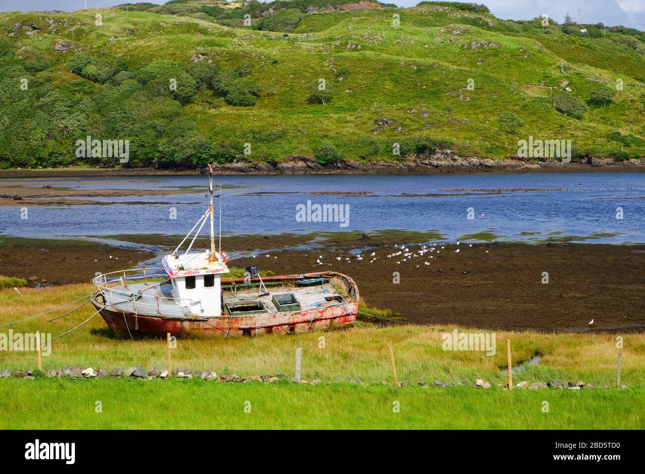 The wreck of a dry boat on the Irish Glen River in County Donegal ...