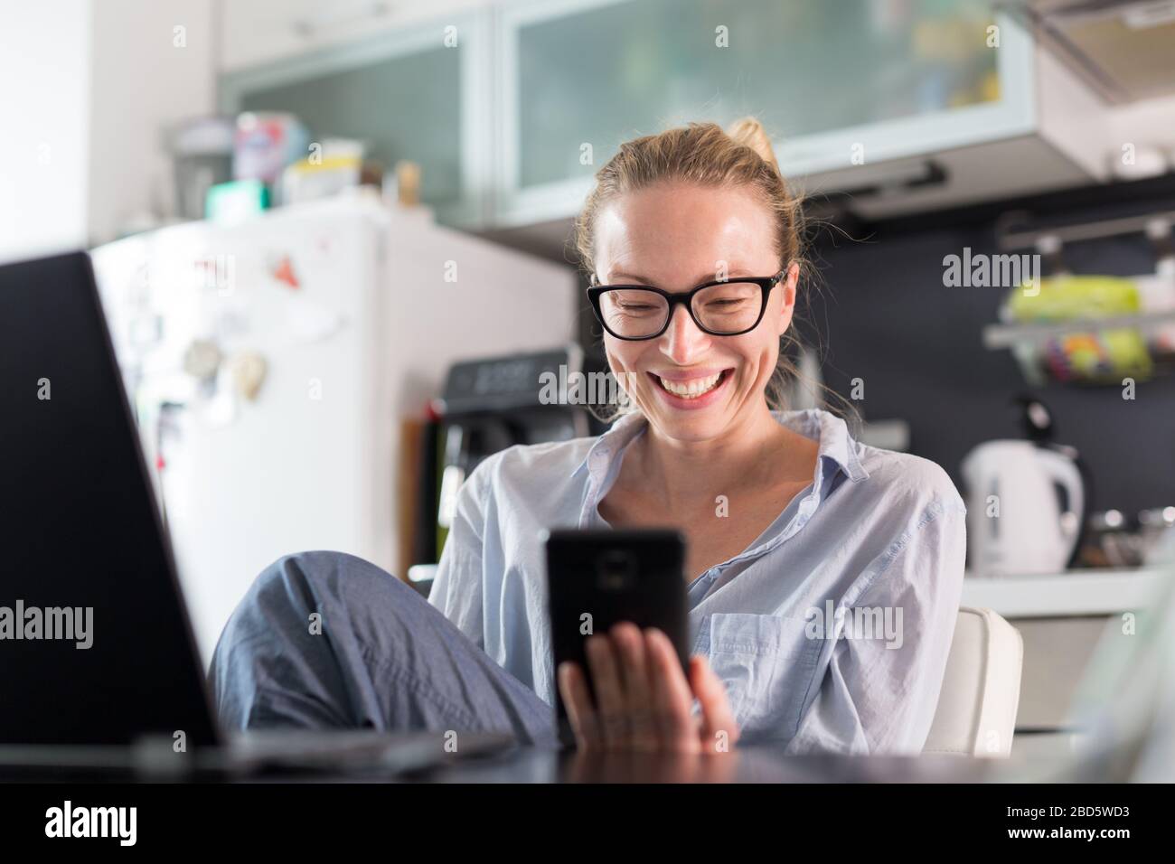 Stay at home and social distancing. Woman in her casual home clothing ...