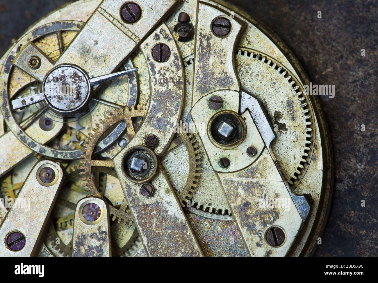 Gears of a vintage metal business clock watch close-up background, time ...