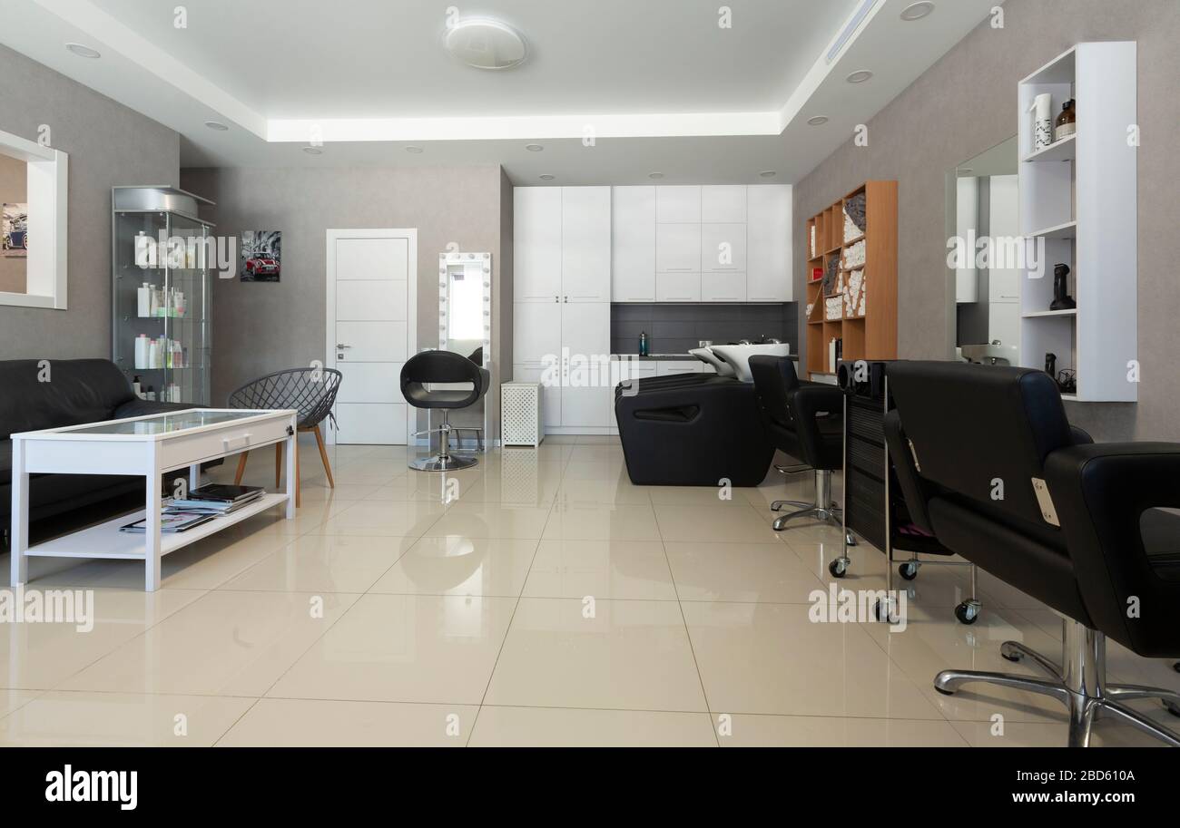 Interior of beauty salon with workplace and armchair for washing hair ...