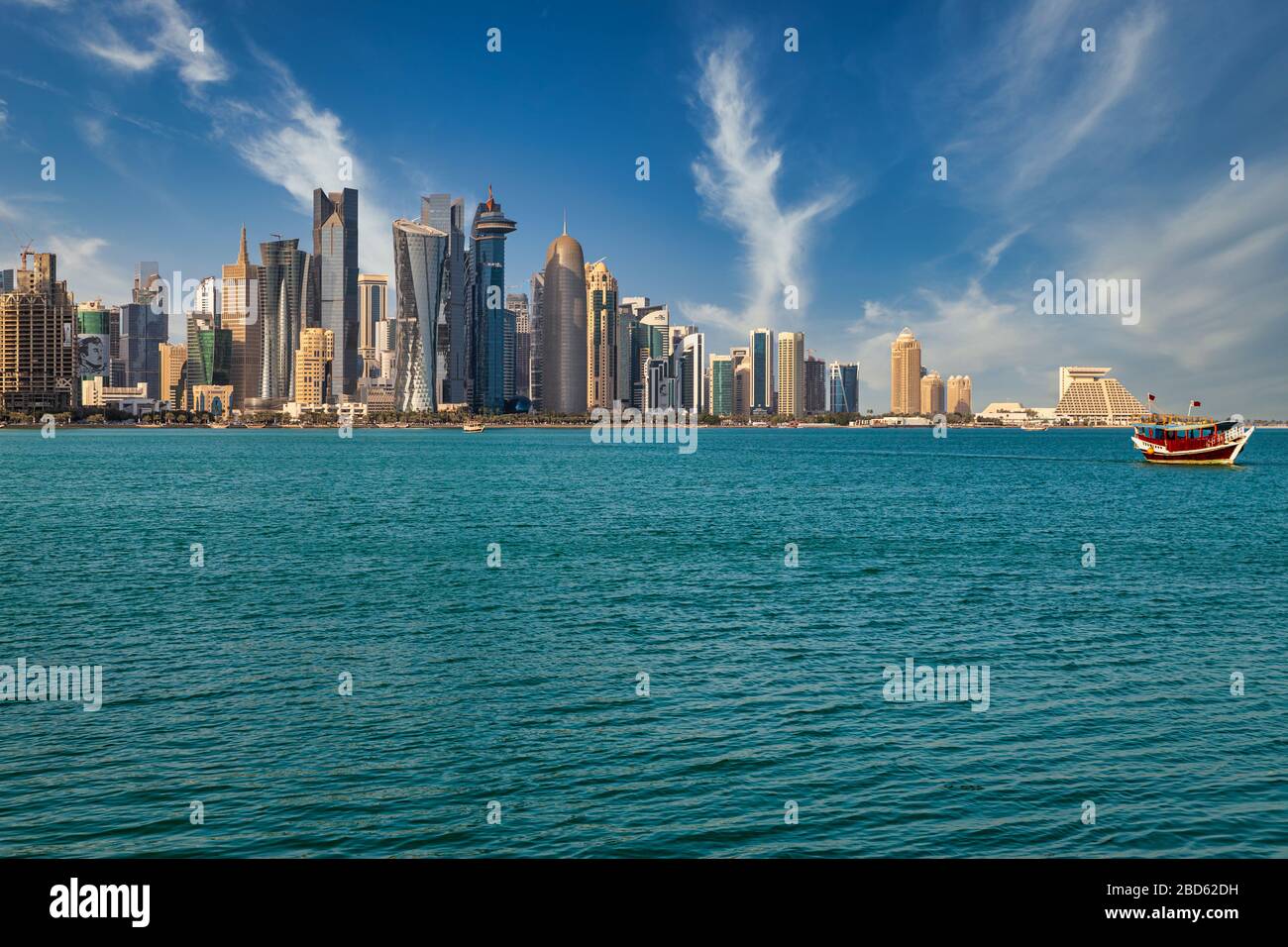 Doha Qatar skyline daylight view with clouds in the sky showing ...