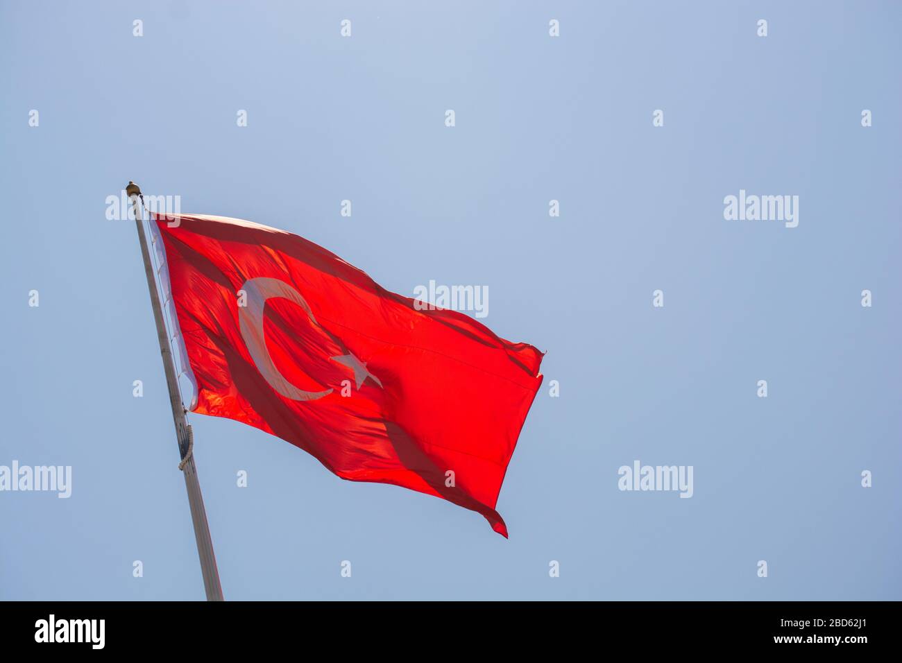 Turkish national flag with white star and moon on a pole in sky Stock ...