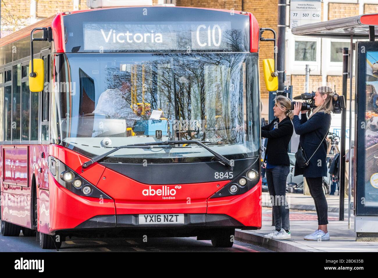 London, UK. 07th Apr, 2020. A bus driver without PPE is interviewed by ...