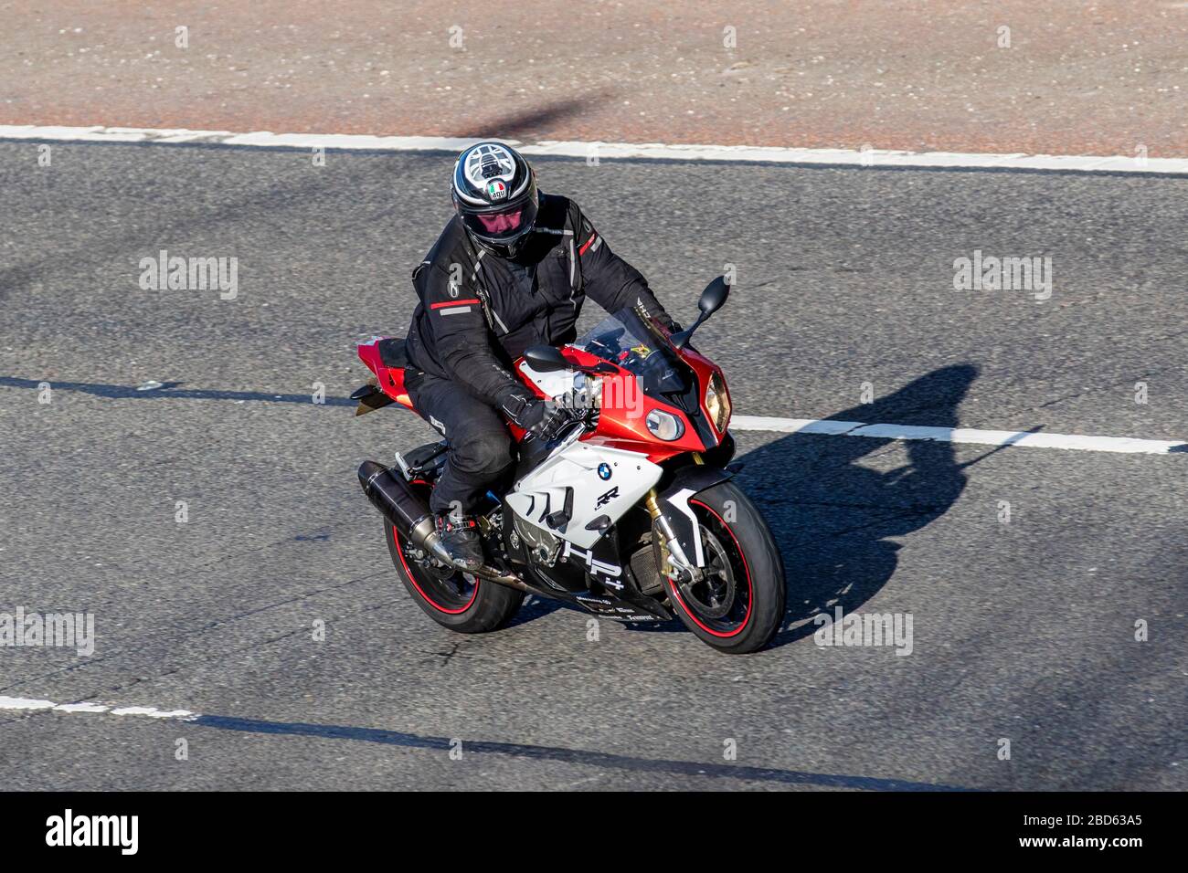 BMW RR s1000 motorbike rider; Vehicular traffic, two-wheeled transport ...