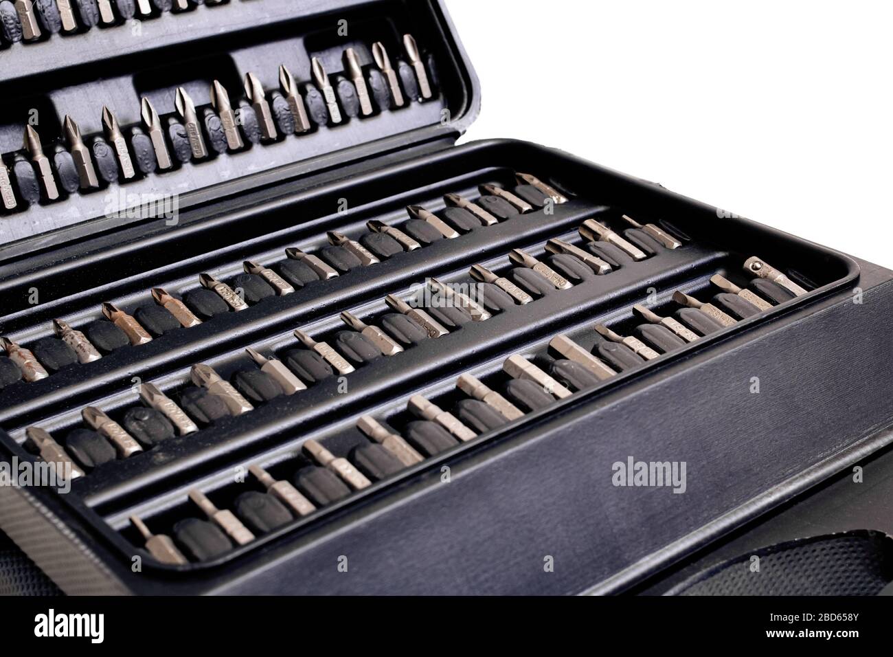 Black plastic box with bits for screwdriver isolated on white ...