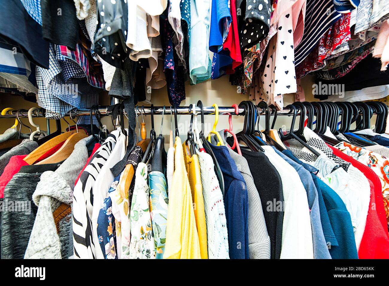 closeup of clothes hanging on hangers in the home wardrobe Stock Photo ...