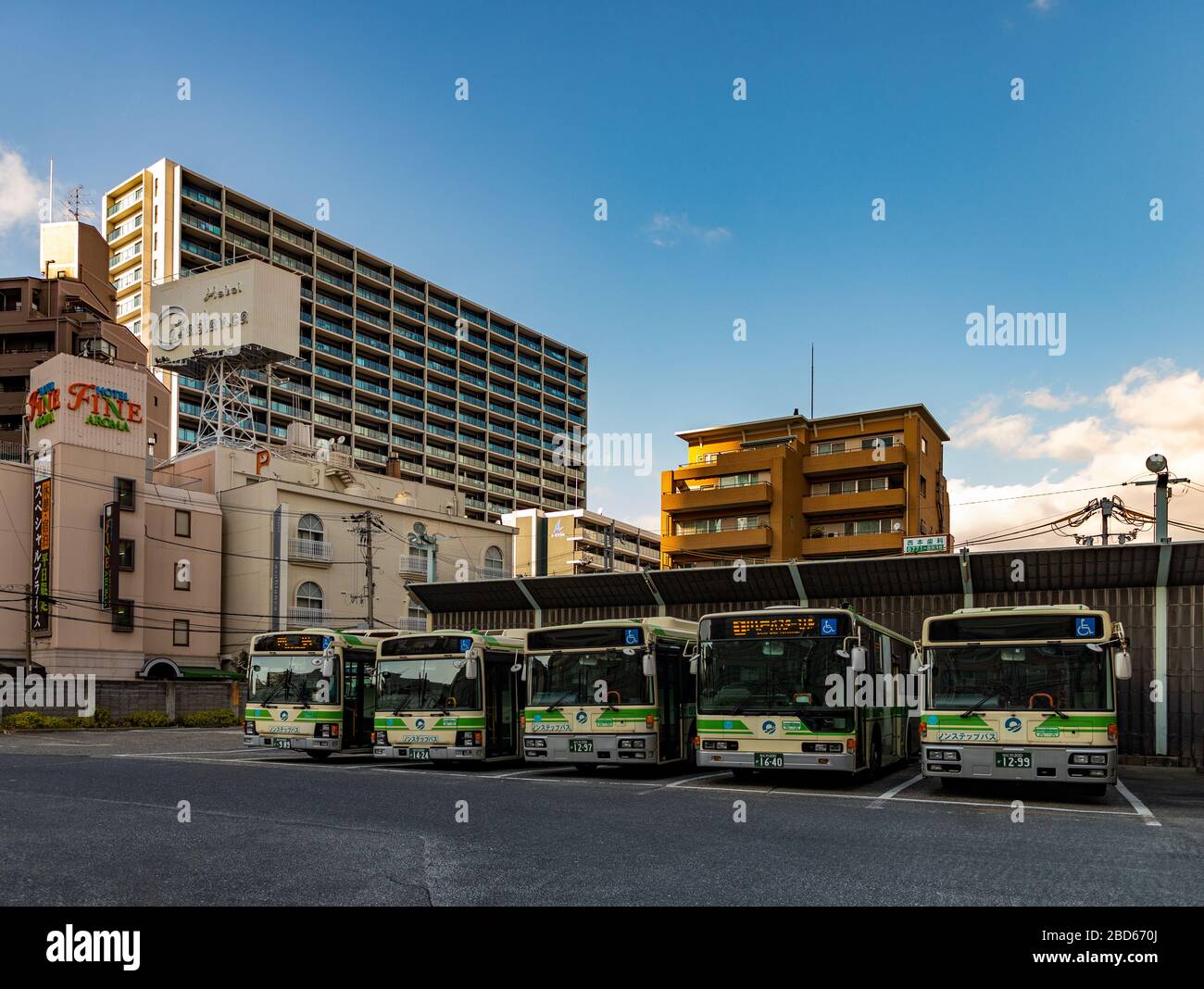 A picture of a group of buses parked in a lot, in Osaka Stock Photo - Alamy