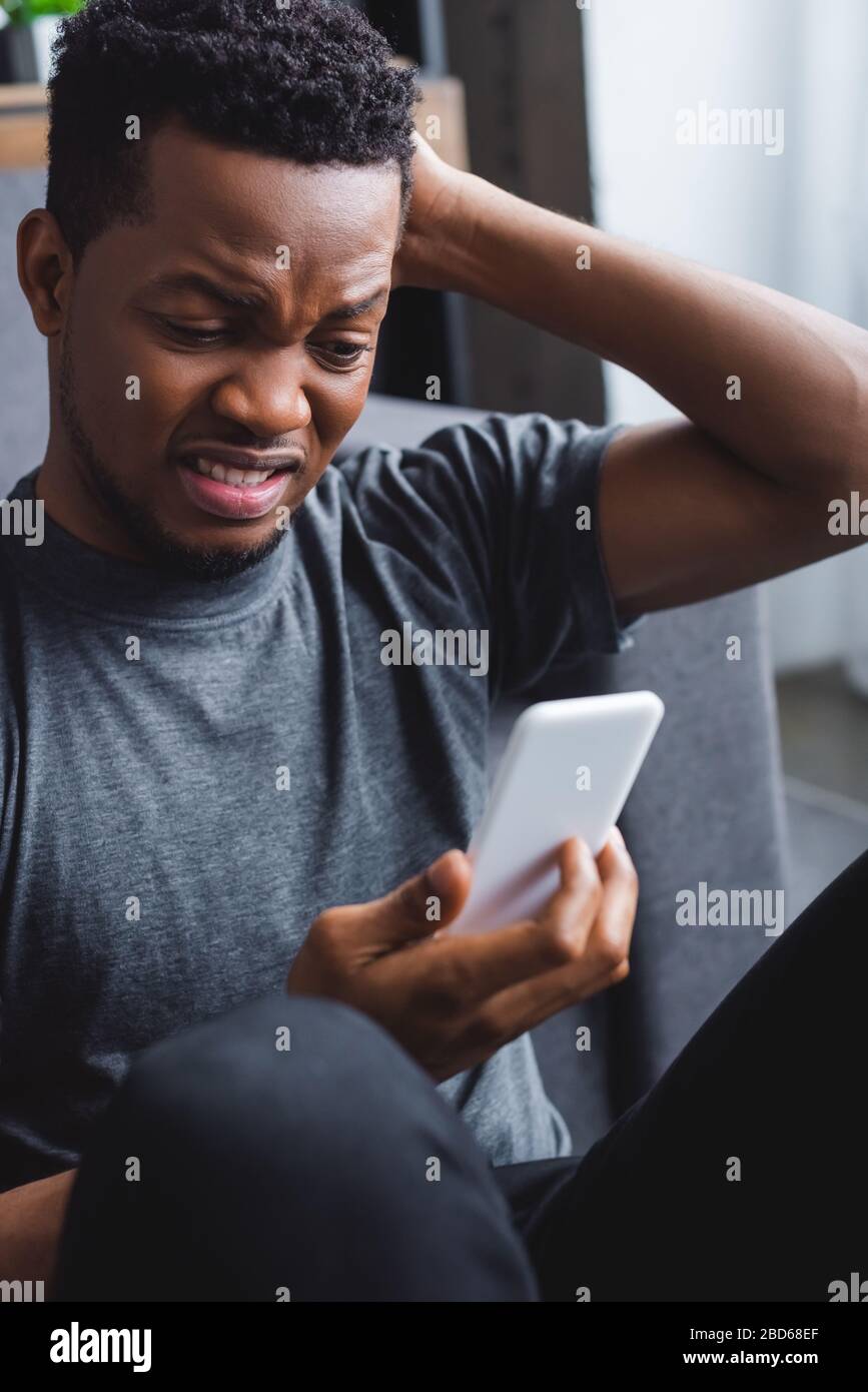 Sad afro american man using hi-res stock photography and images - Alamy