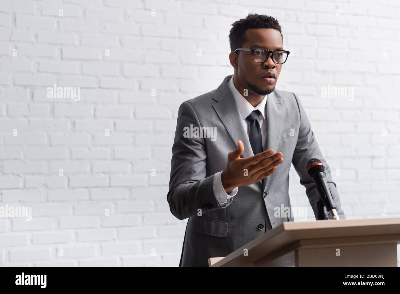 Young african man speech podium hi-res stock photography and images - Alamy