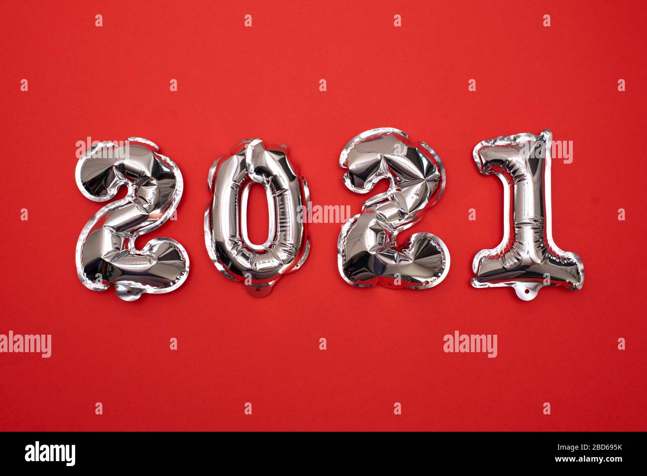Golden Christmas 2021 balloons on red background. Helium balloons, gold ...