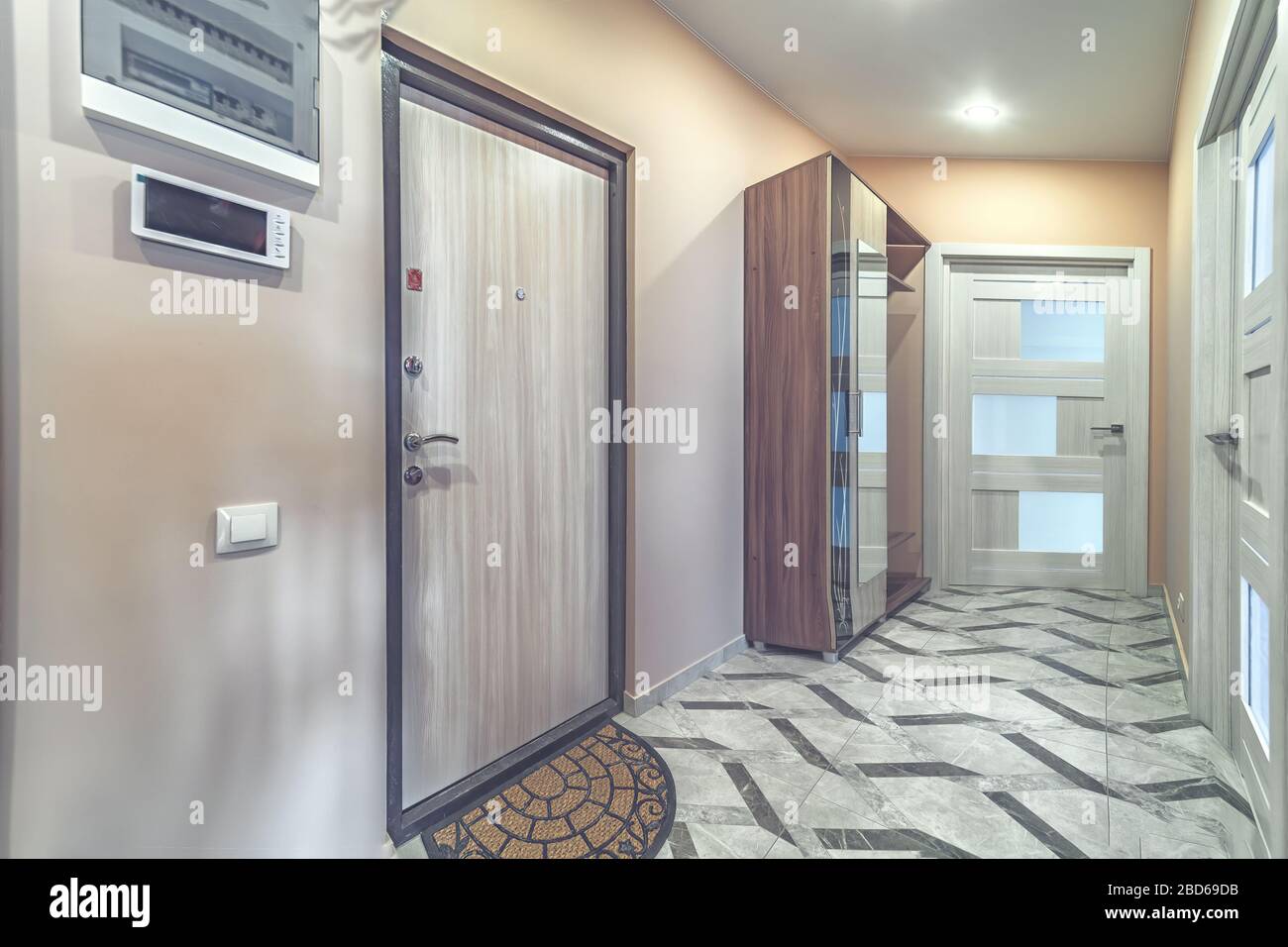 Empty residential house entrance with closed wooden doors tiny hallway ...