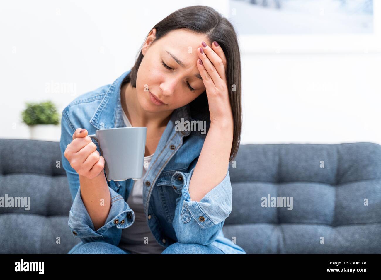 Single young woman sad and lonely at home Stock Photo - Alamy