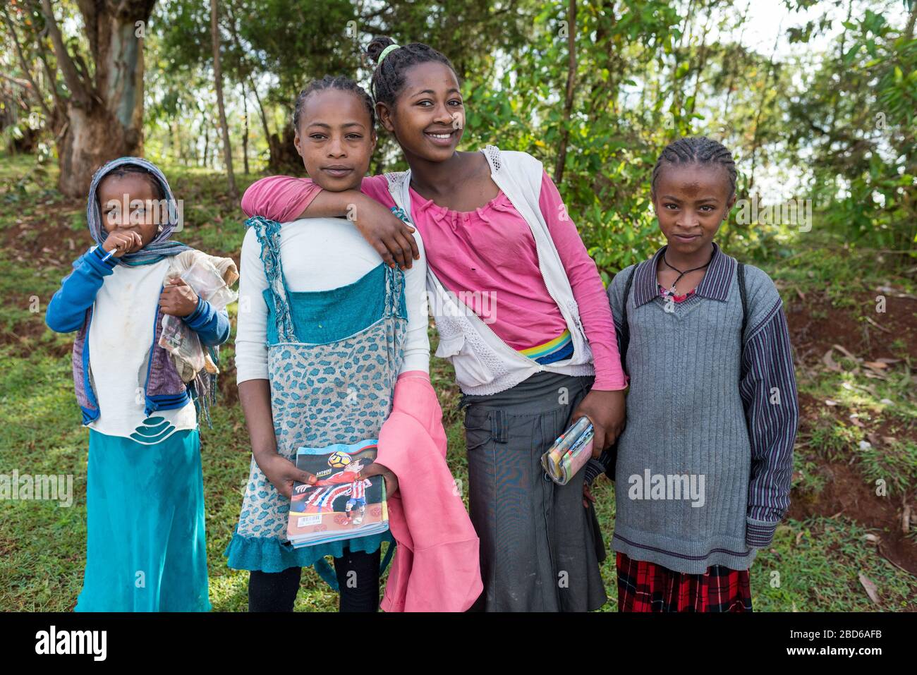 Friends walk to school, members of the Dorze ethnic group or tribe ...