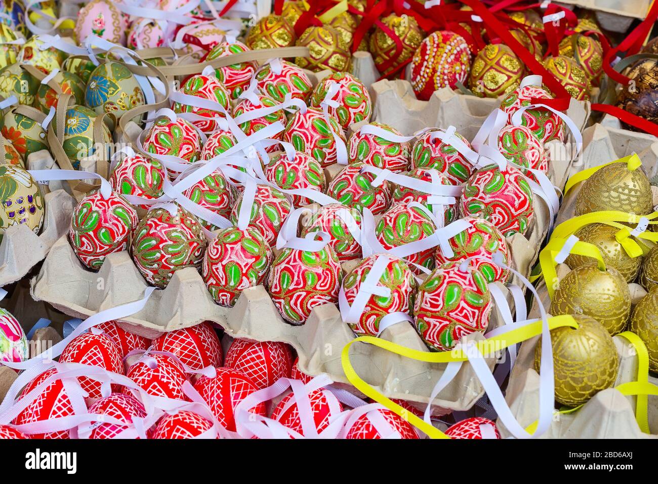colorful painted easter eggs in basket at the traditional European ...