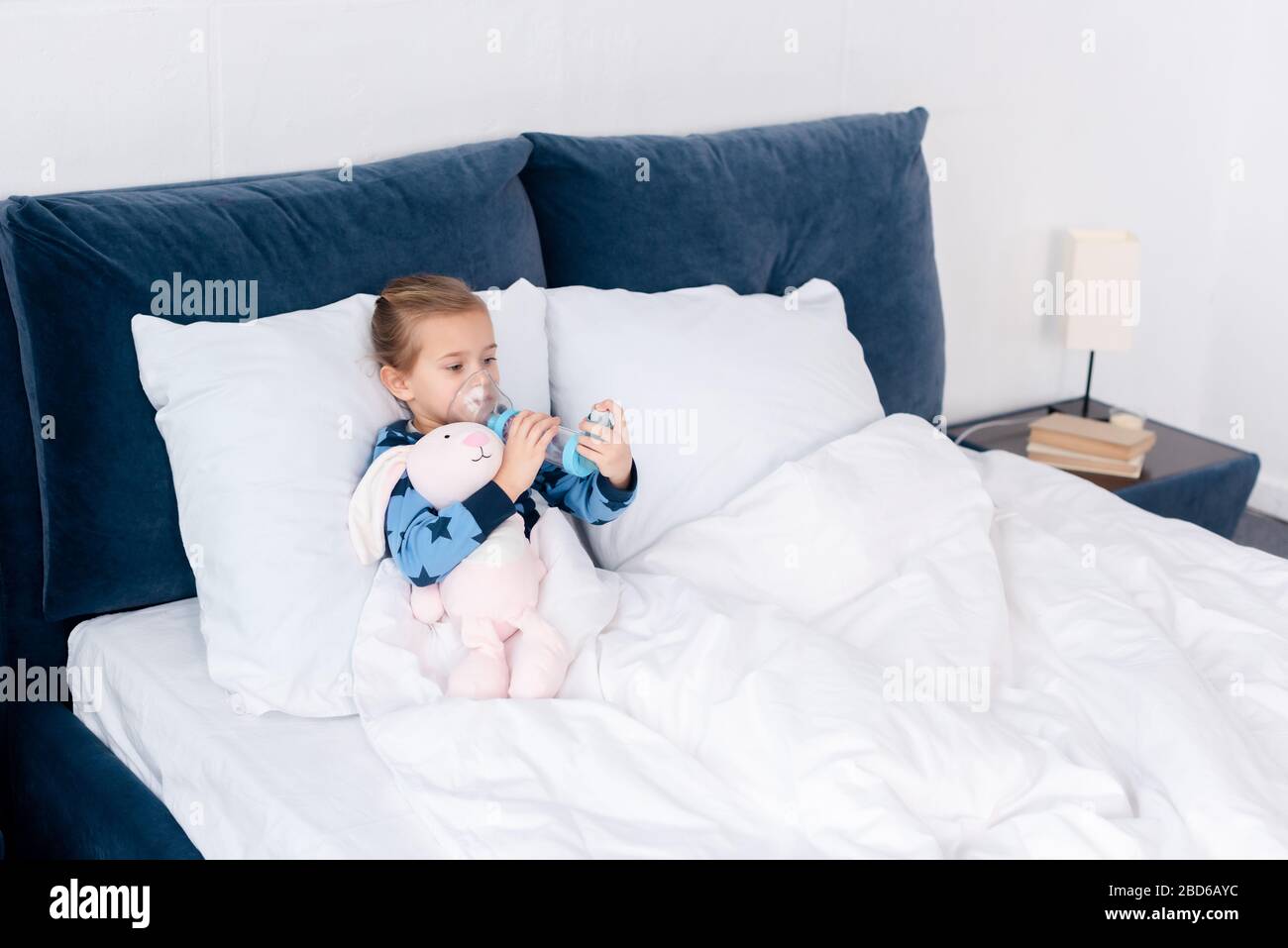 Child using inhaler and spacer hi-res stock photography and images - Alamy