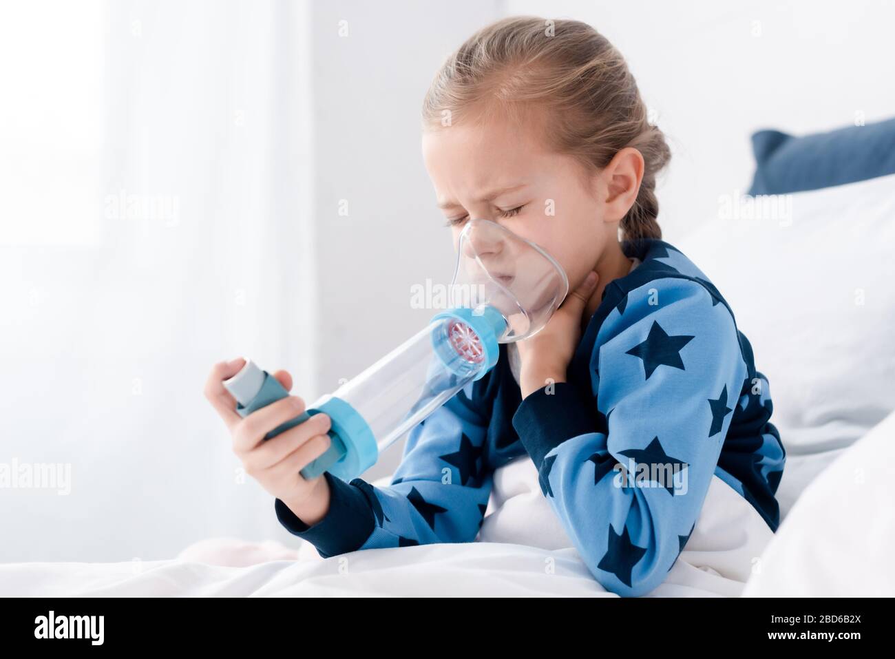 Child using inhaler and spacer hi-res stock photography and images - Alamy