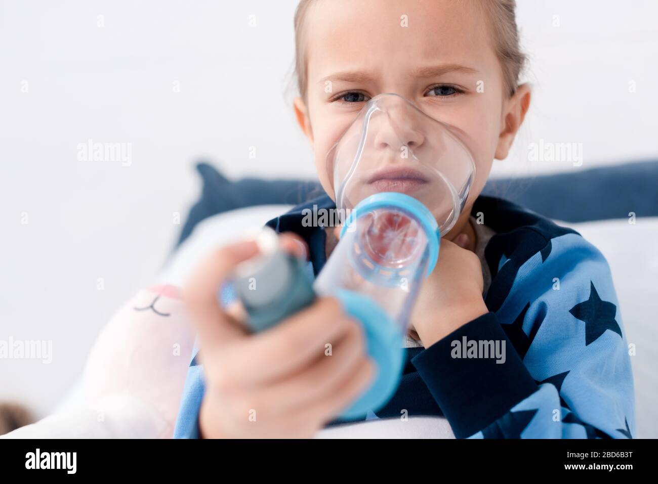 Child using inhaler and spacer hi-res stock photography and images - Alamy