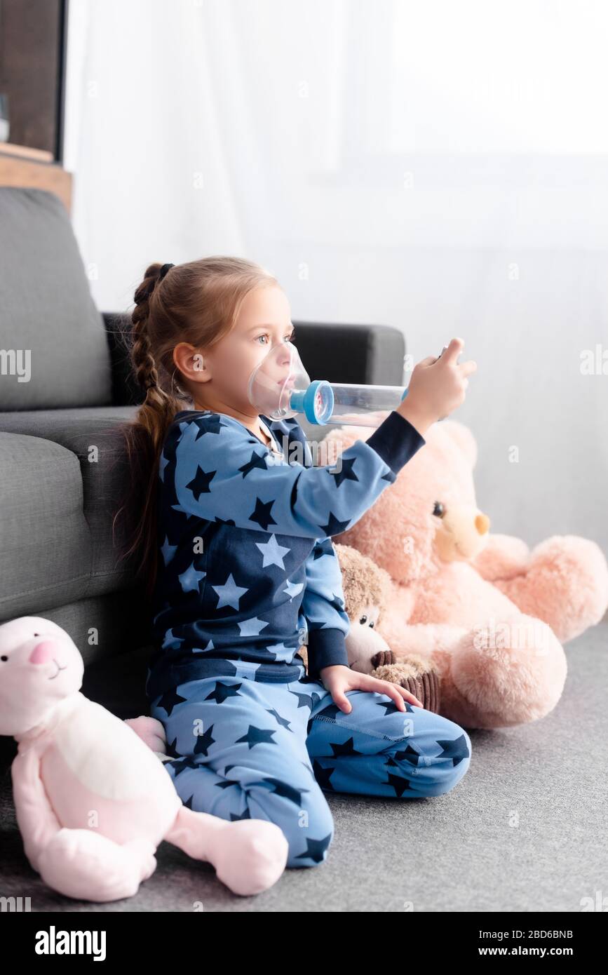Child using inhaler and spacer hi-res stock photography and images - Alamy