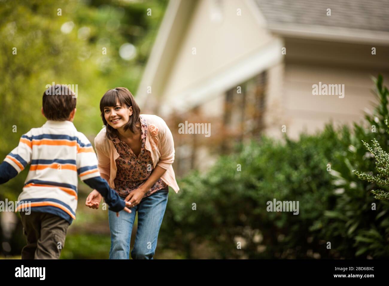 Young boy runs to his mother Stock Photo - Alamy