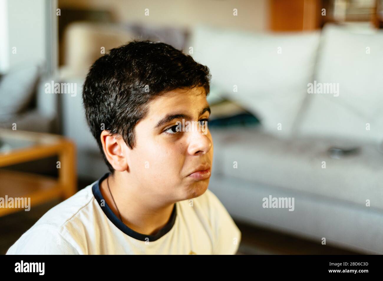 Young boy concentrating hi-res stock photography and images - Alamy
