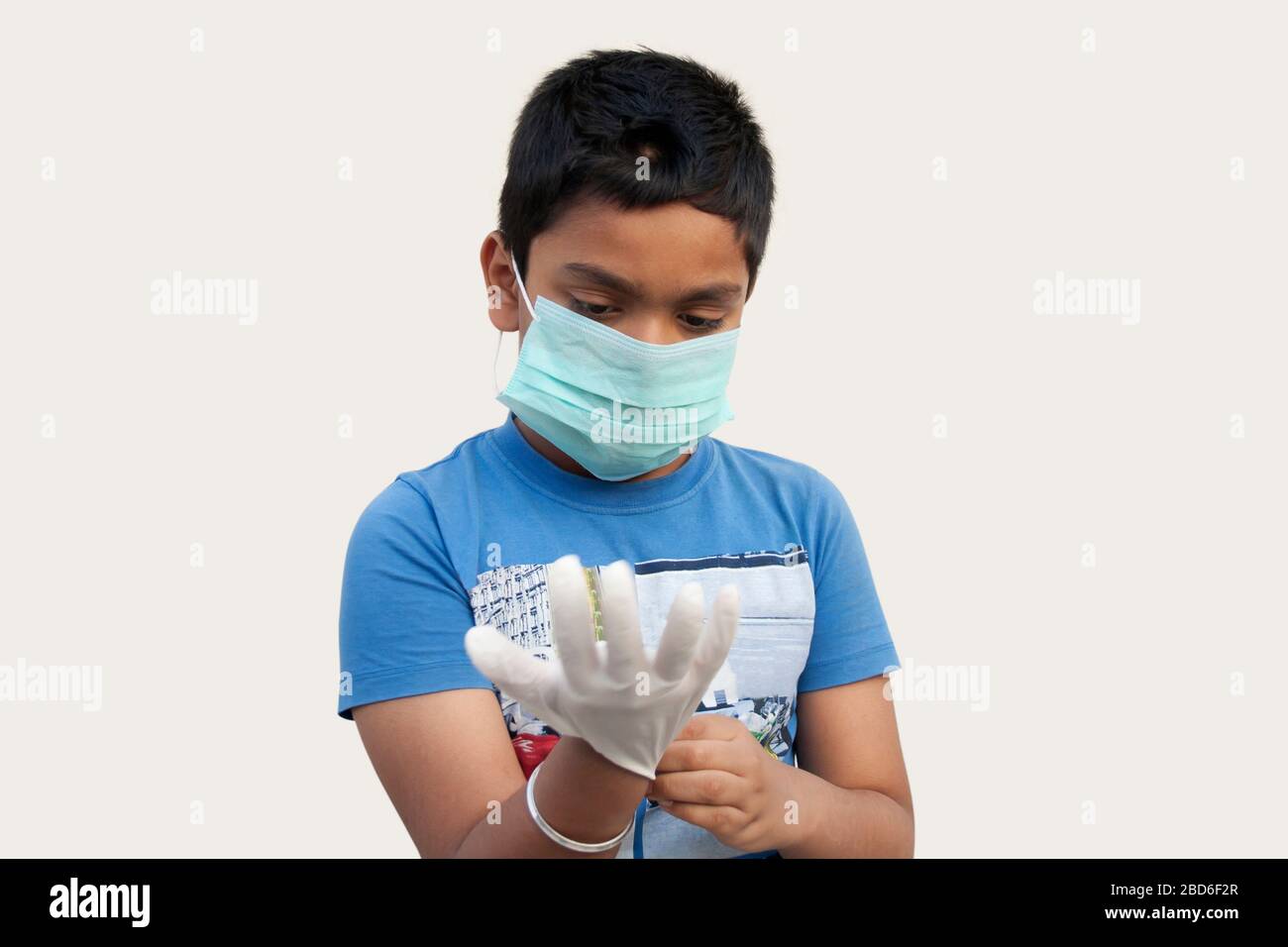 Boy wearing protective mask and rubber gloves Stock Photo - Alamy